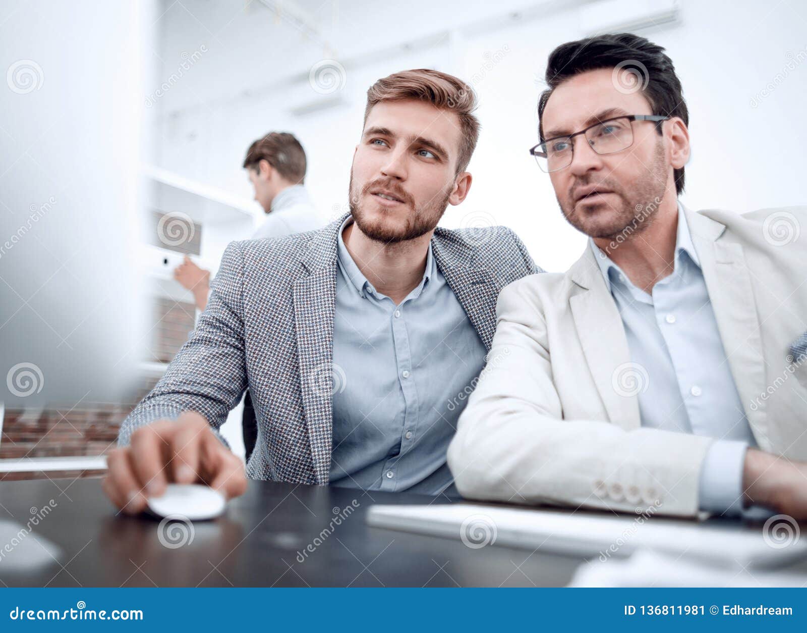 Two Businessmen Use a Computer To Get New Information Stock Image ...