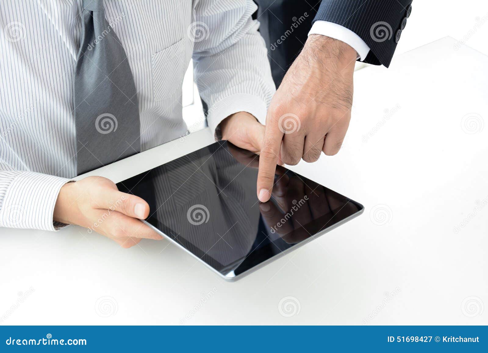 Two Businessmen Using Tablet Computer with One Hand Touching Screen ...