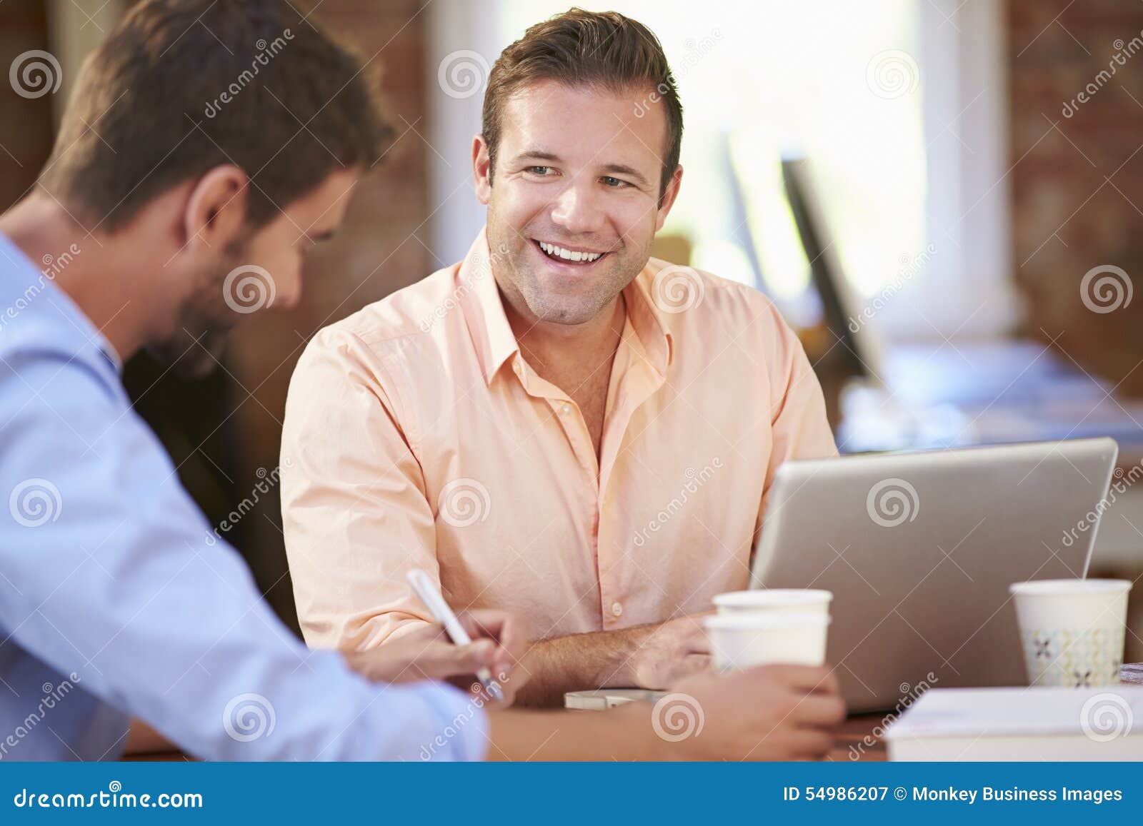 Two Businessmen Working at Desk Together Stock Image - Image of group ...