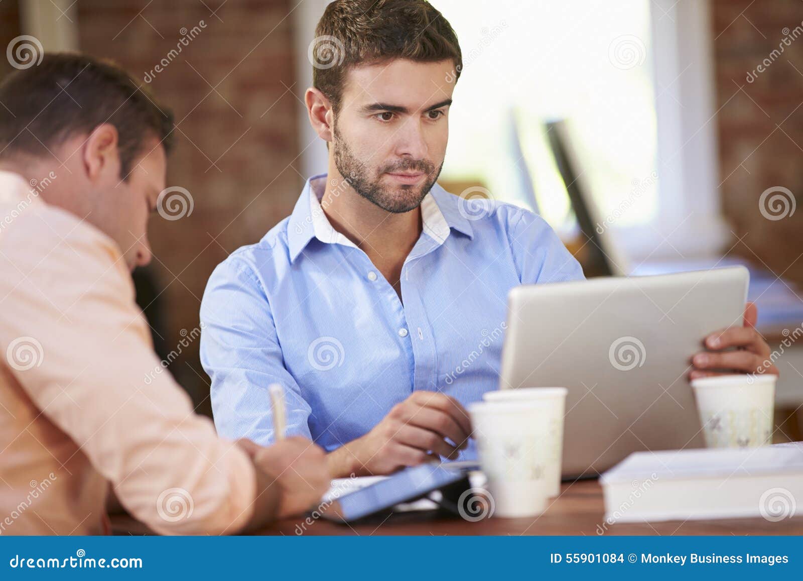 Two Businessmen Working at Desk Together Stock Photo - Image of digital ...