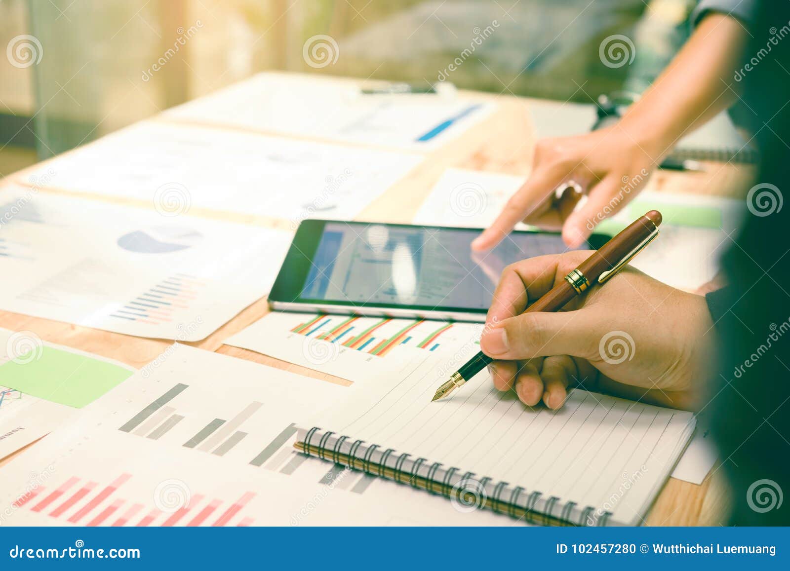 Two Businessmen Working with a Digital Tablet with Data Information on ...
