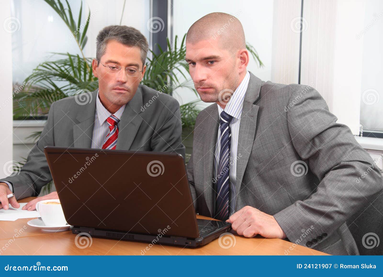 Two Businessmen Working Together on a Project Stock Image - Image of ...