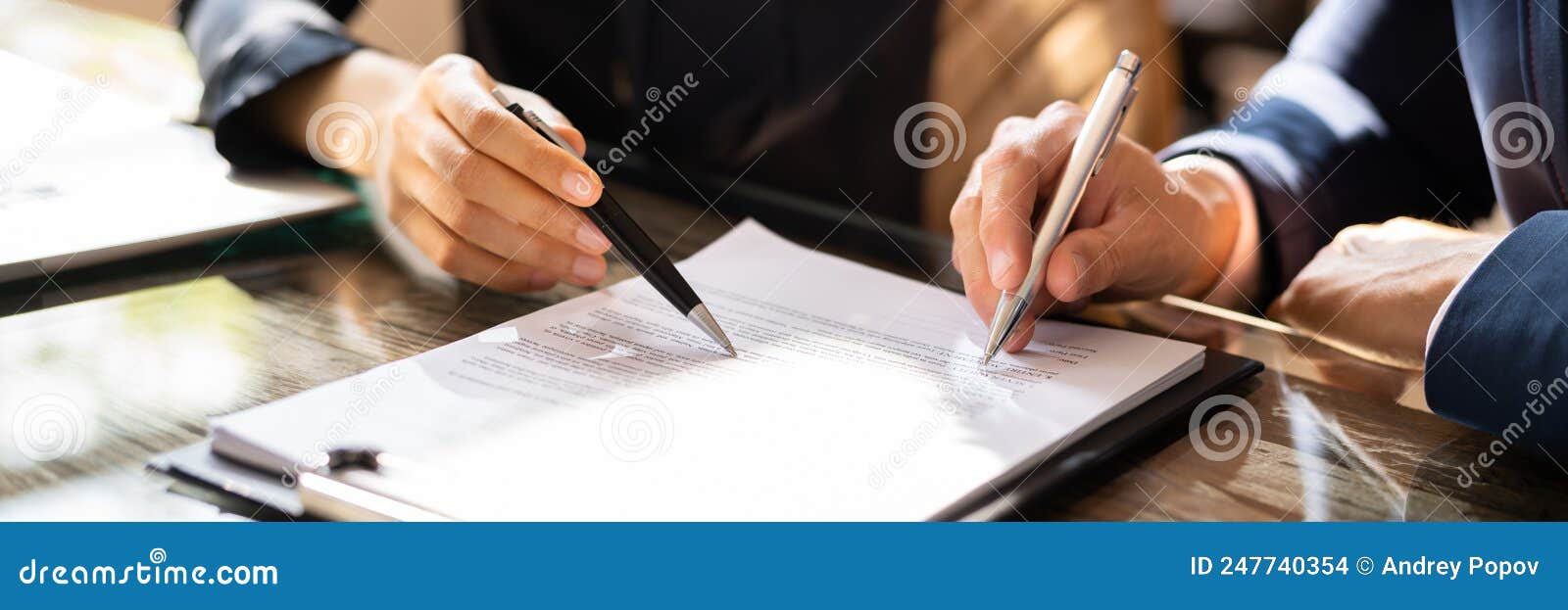 Two Businesspeople Analyzing Document Stock Photo - Image of hand ...