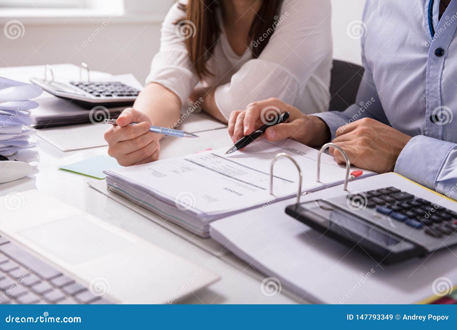 Two Businesspeople Checking Invoice Stock Image - Image of accountant ...