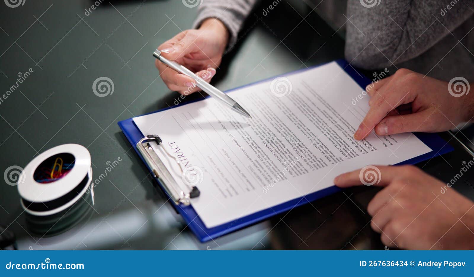 Two Businesspeople Hand Analyzing Document Over Glass Stock Photo ...