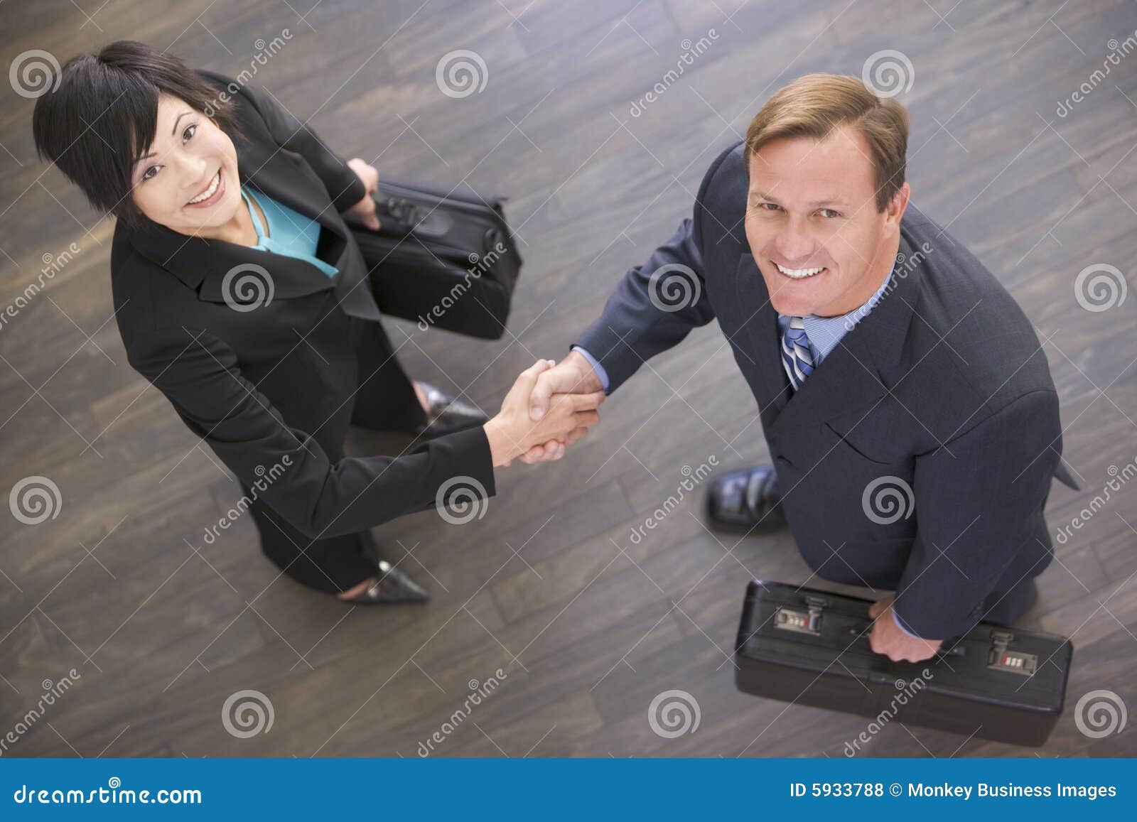 Two Businesspeople Indoors Shaking Hands Smiling Stock Photo - Image of ...