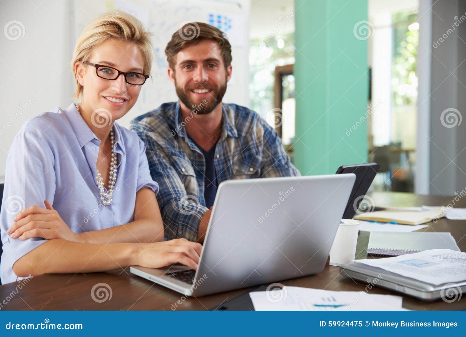Two Businesspeople Working on Laptop in Office Together Stock Image ...