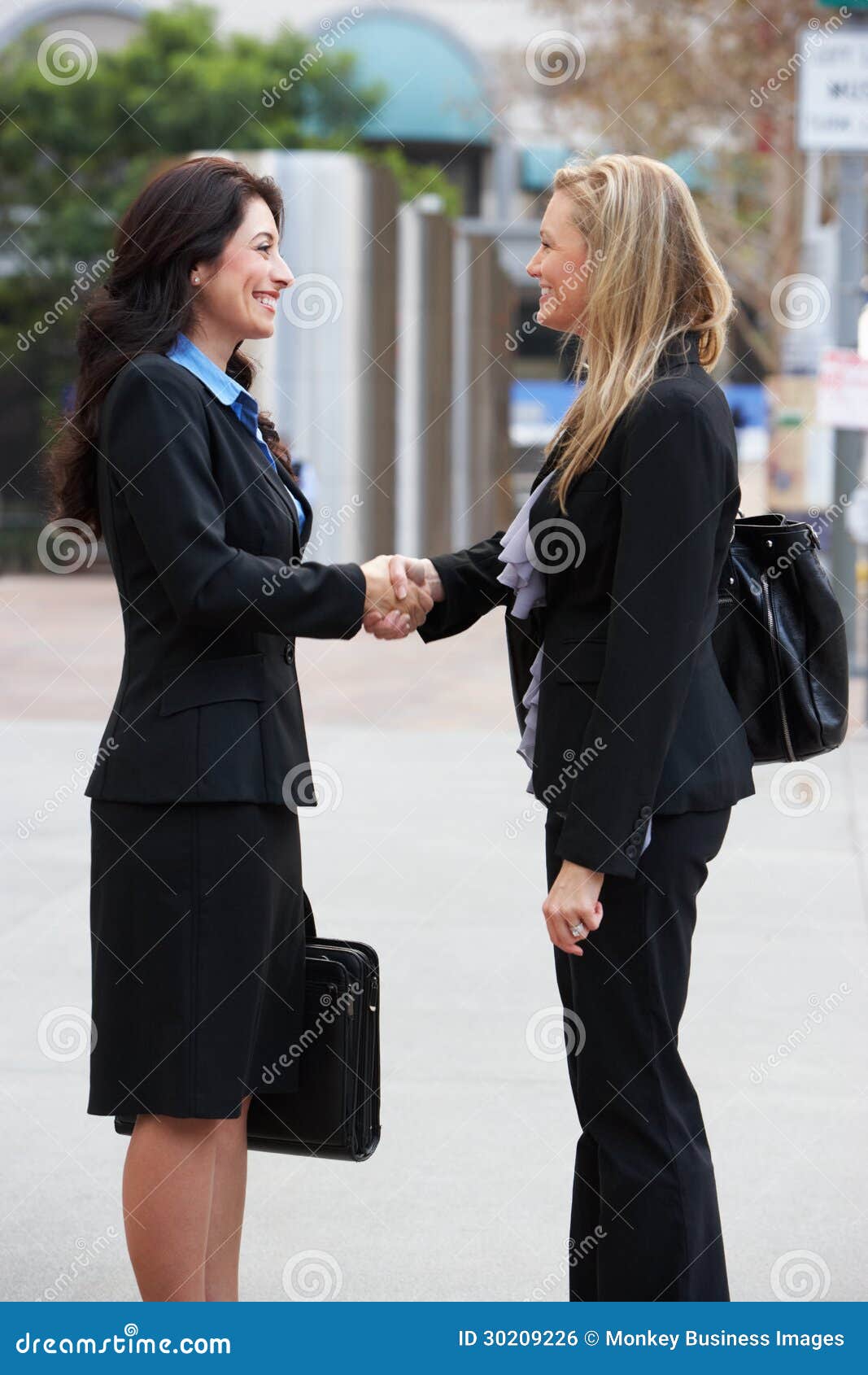 Two Businesswomen Shaking Hands Outside Office Stock Photo - Image of ...