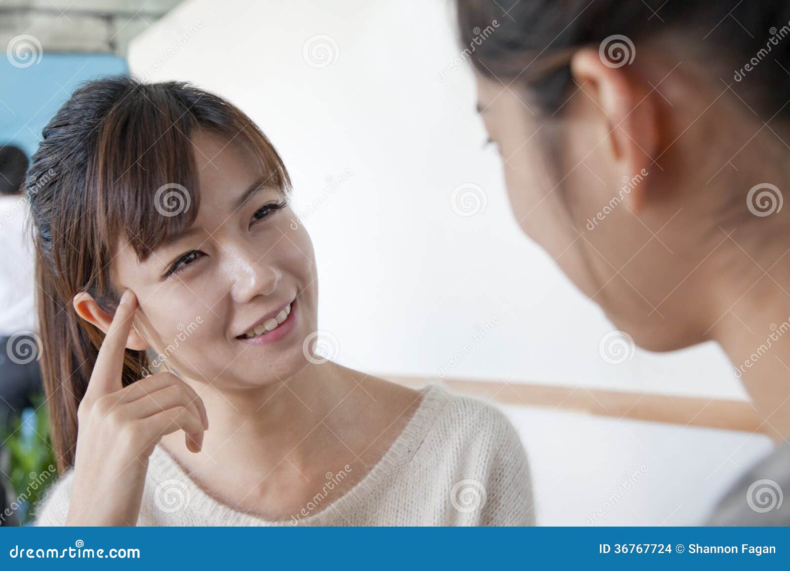 Two Businesswomen Talking, One of Them Thinking Stock Photo - Image of ...