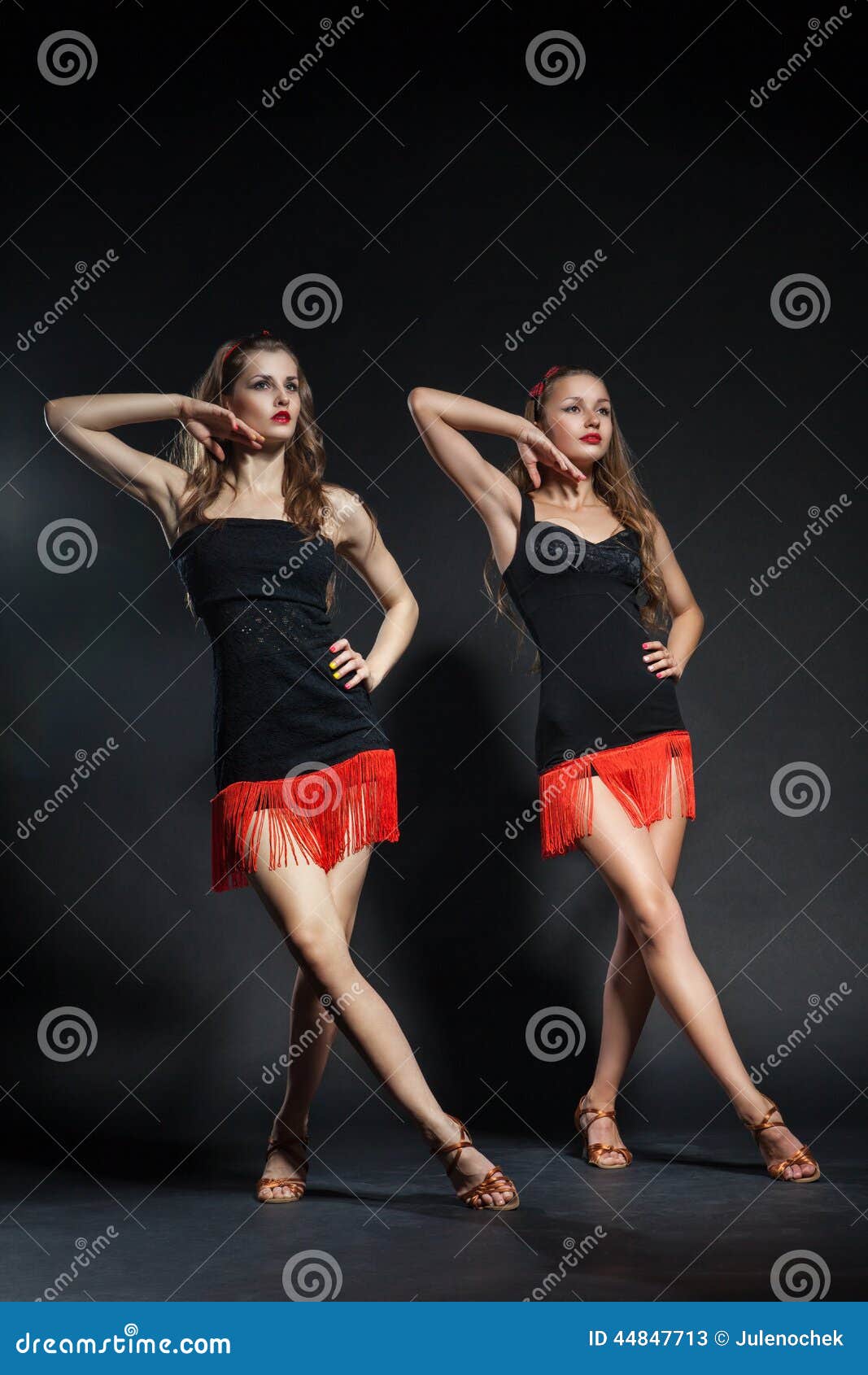 Two Cabaret Dancers in Bright Costumes Over Dark Stock Image - Image of ...