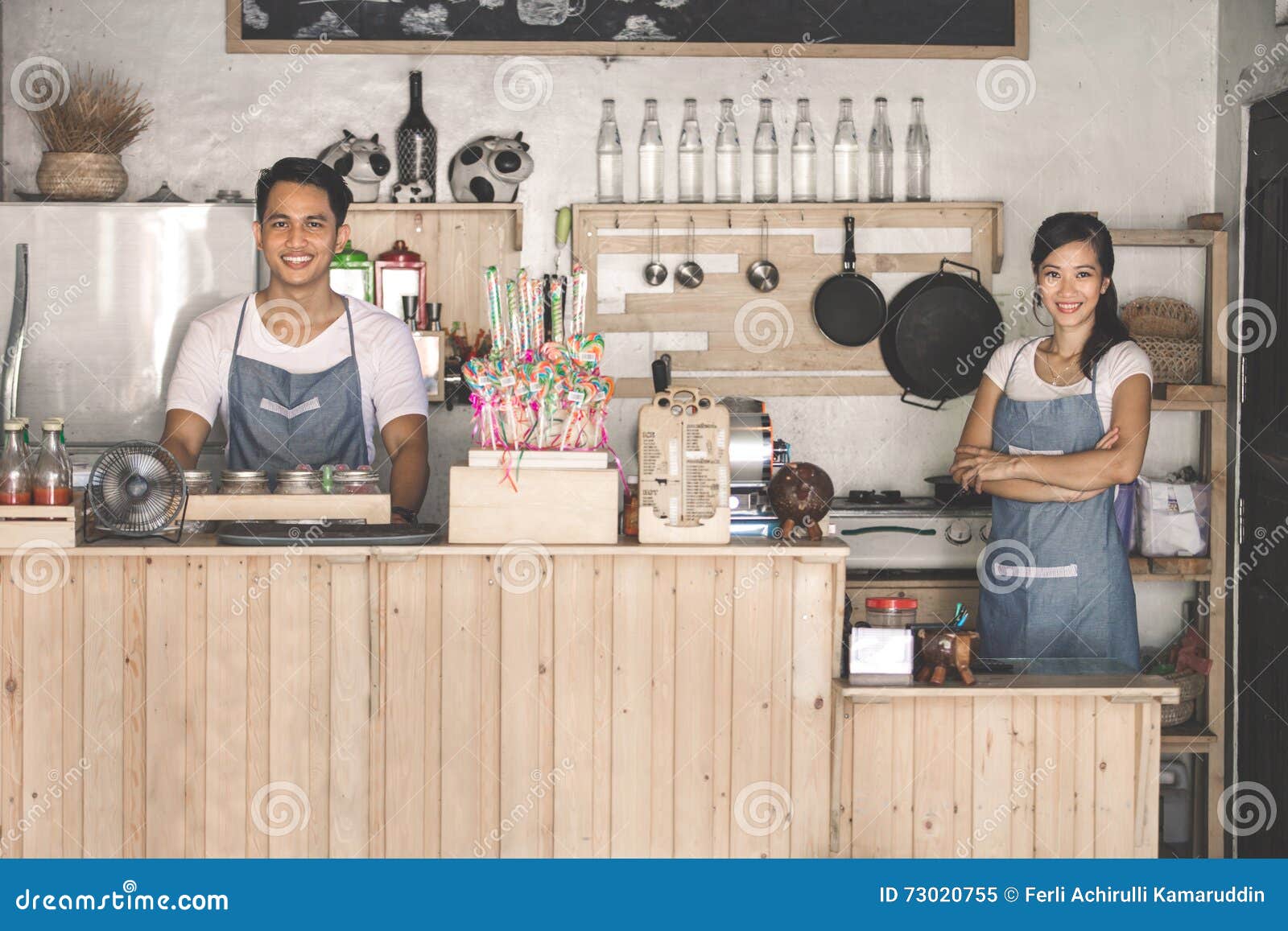 Two Cafe staff at work stock image. Image of selective - 73020755
