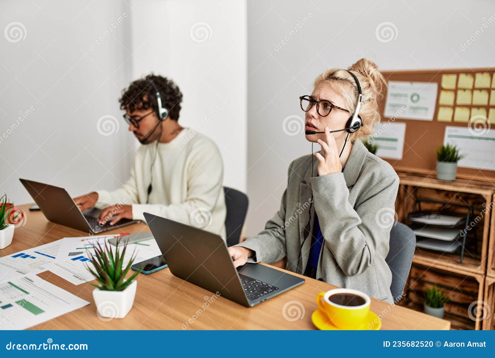 Two Call Center Agents Working at the Office Stock Photo - Image of ...