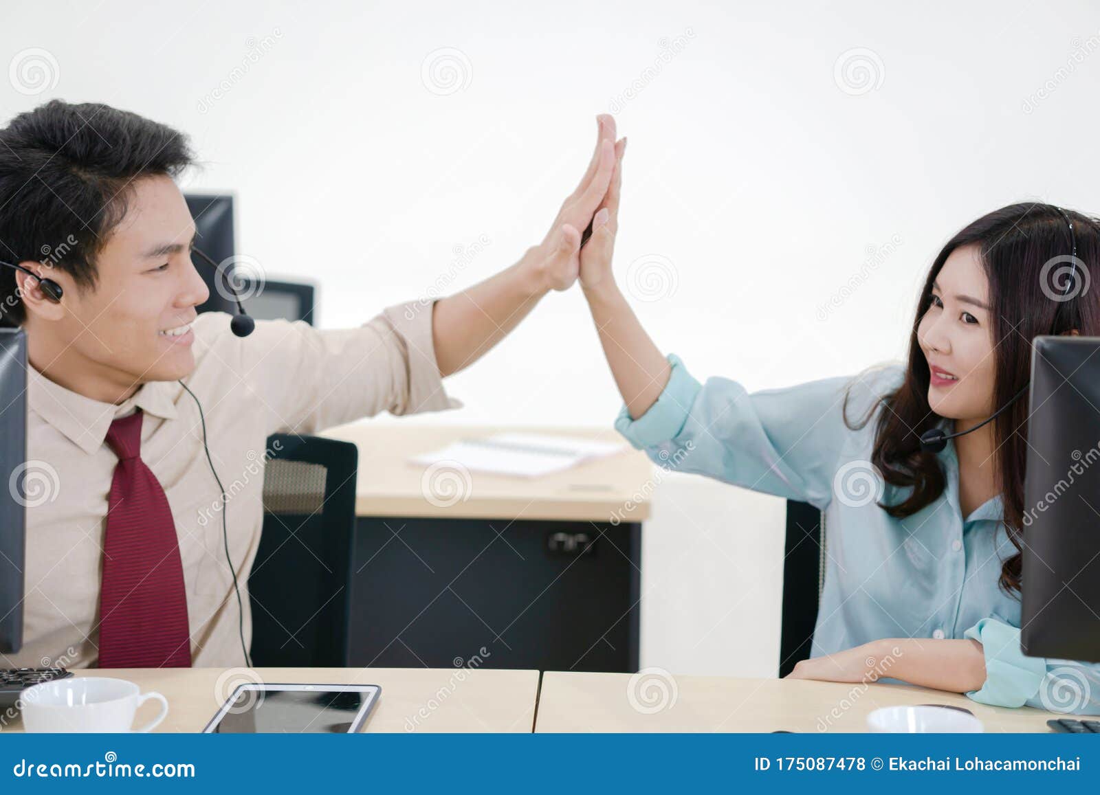 Two Call Center Workers Giving High Five To Each Other at Office Stock ...