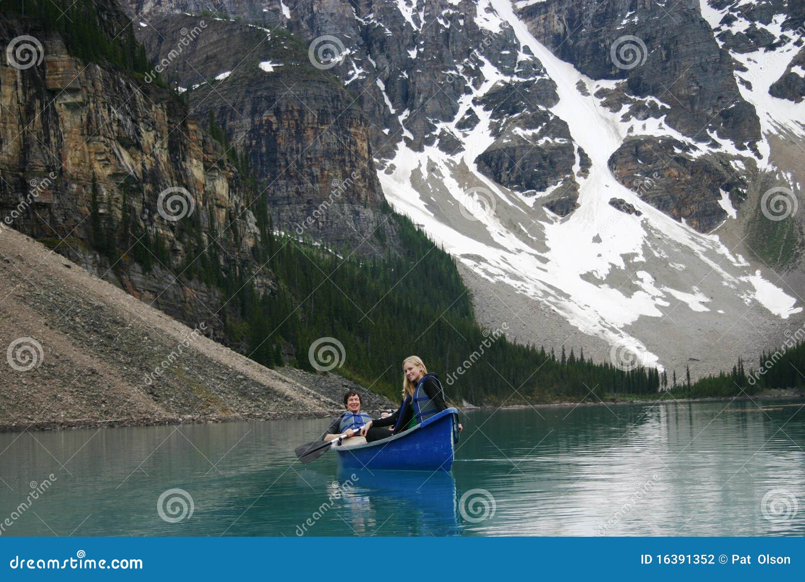 Two canoers stock photo. Image of water, green, blue - 16391352