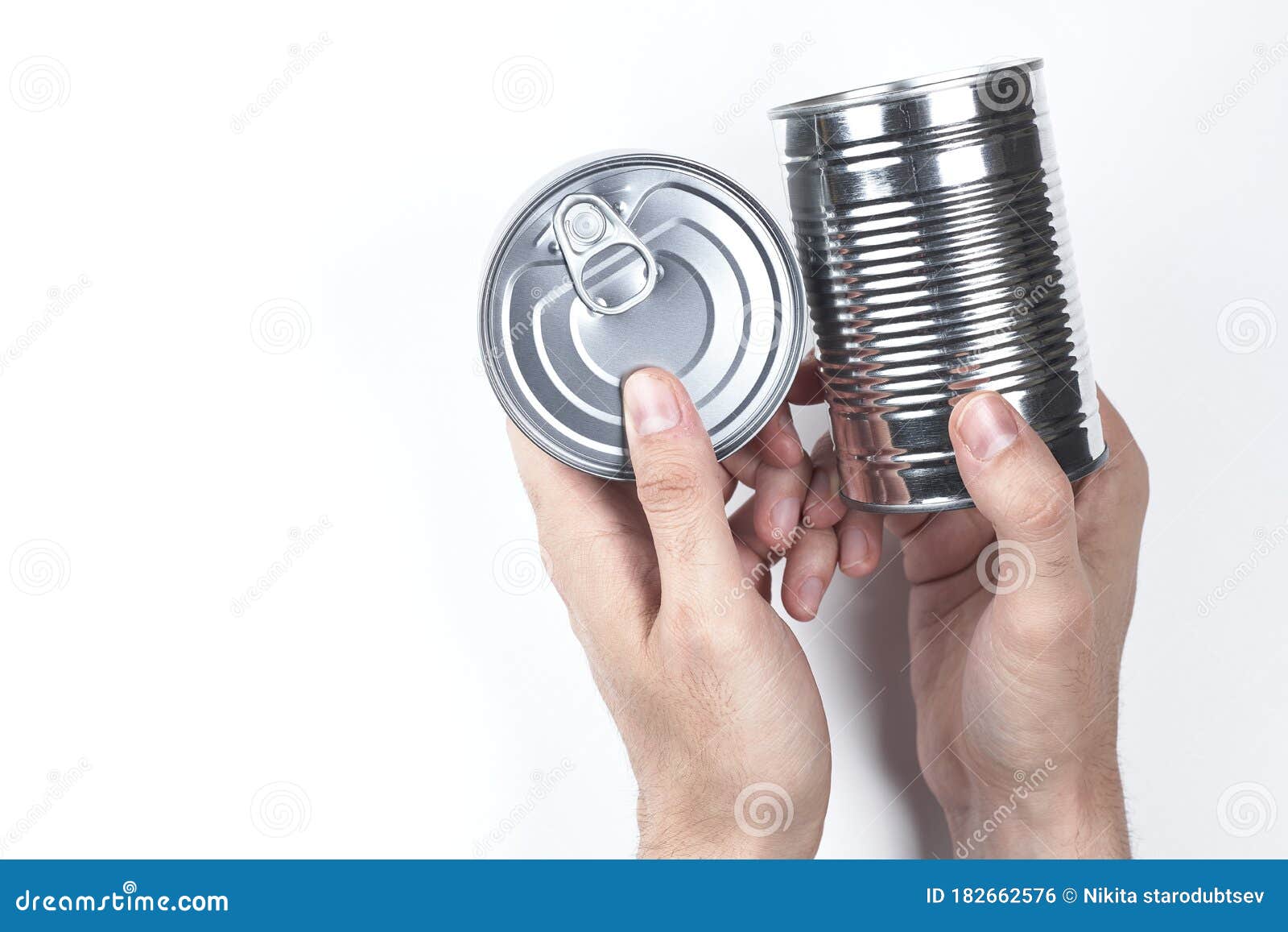 Two Cans in Hand on a White Background. Top View Stock Photo - Image of ...