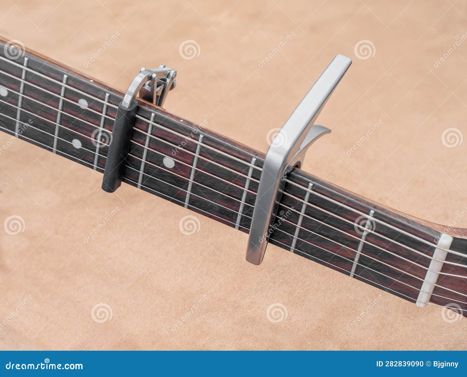 Two Capo on the Acoustic Guitar Neck , Capro Made from Aluminium ...