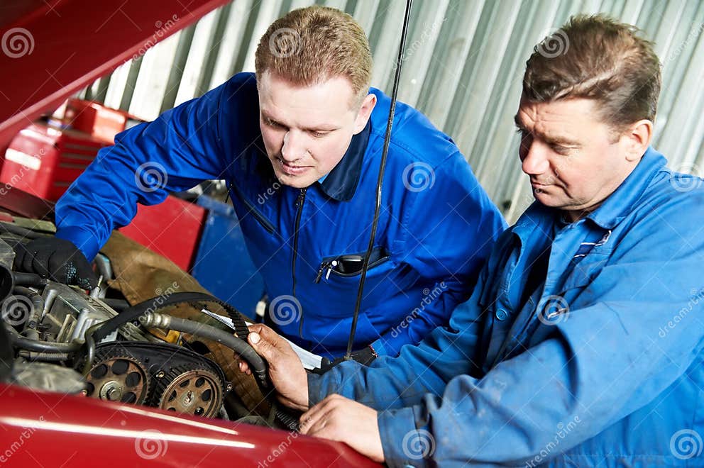 Two Car Mechanic Diagnosing Auto Engine Problem Stock Photo - Image of ...