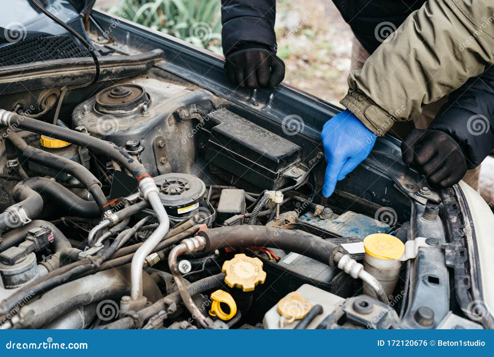 Two Car Mechanic Engineers Checking, Fixing the Car, Making Maintenance ...