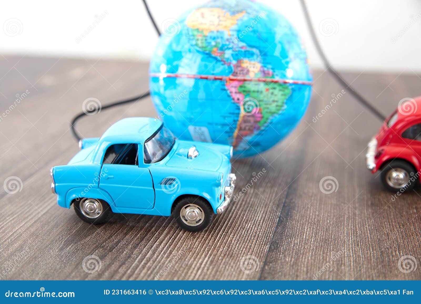 Two Car Models on the Table are Connected with a Globe, Which Means To ...