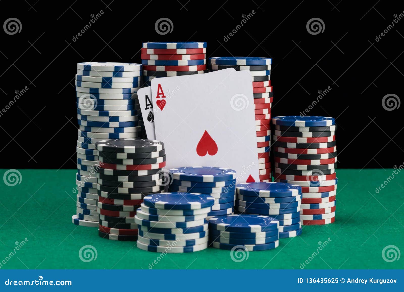 Two Cards are in a Stack of Poker Chips on a Green Table Stock Image ...