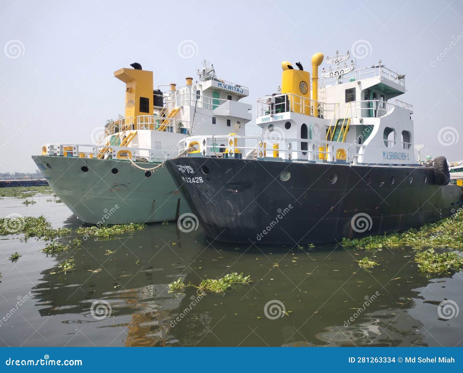 Two Cargo Ships are Anchored in the Middle of the River Editorial Stock ...