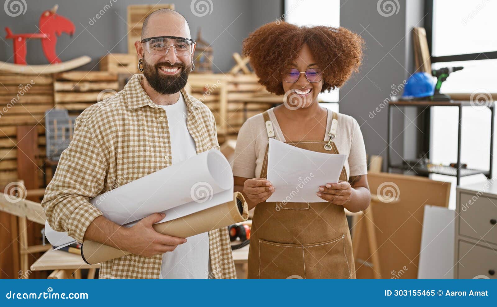 Two Carpenters Wearing Safety Glasses Holding Documents at Carpentry ...