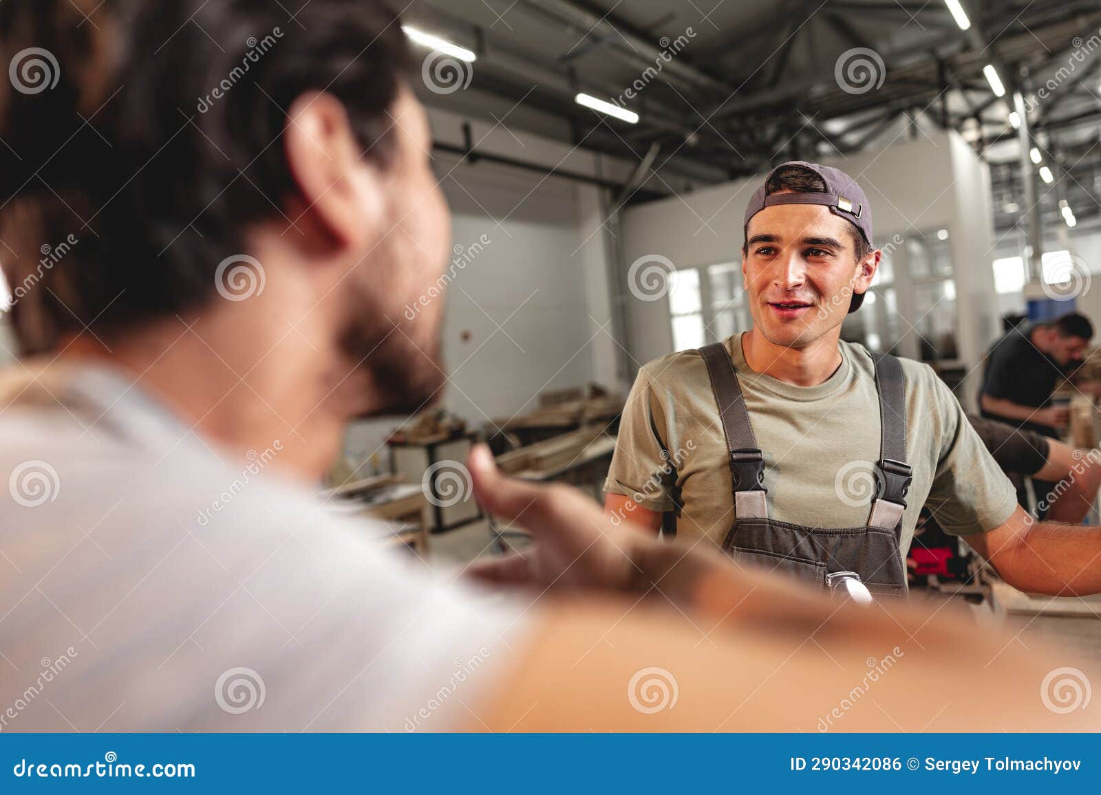 Two Carpenters Working Together at a Workshop Close Up Stock Photo ...
