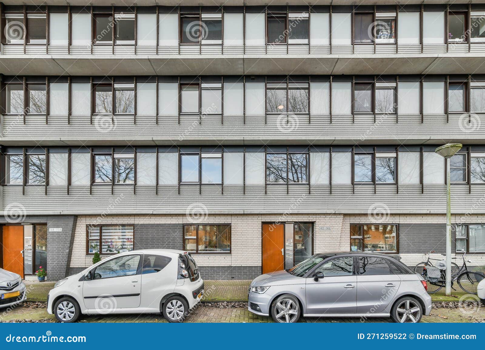 Two Cars Parked in Front of a Building Editorial Photography - Image of ...