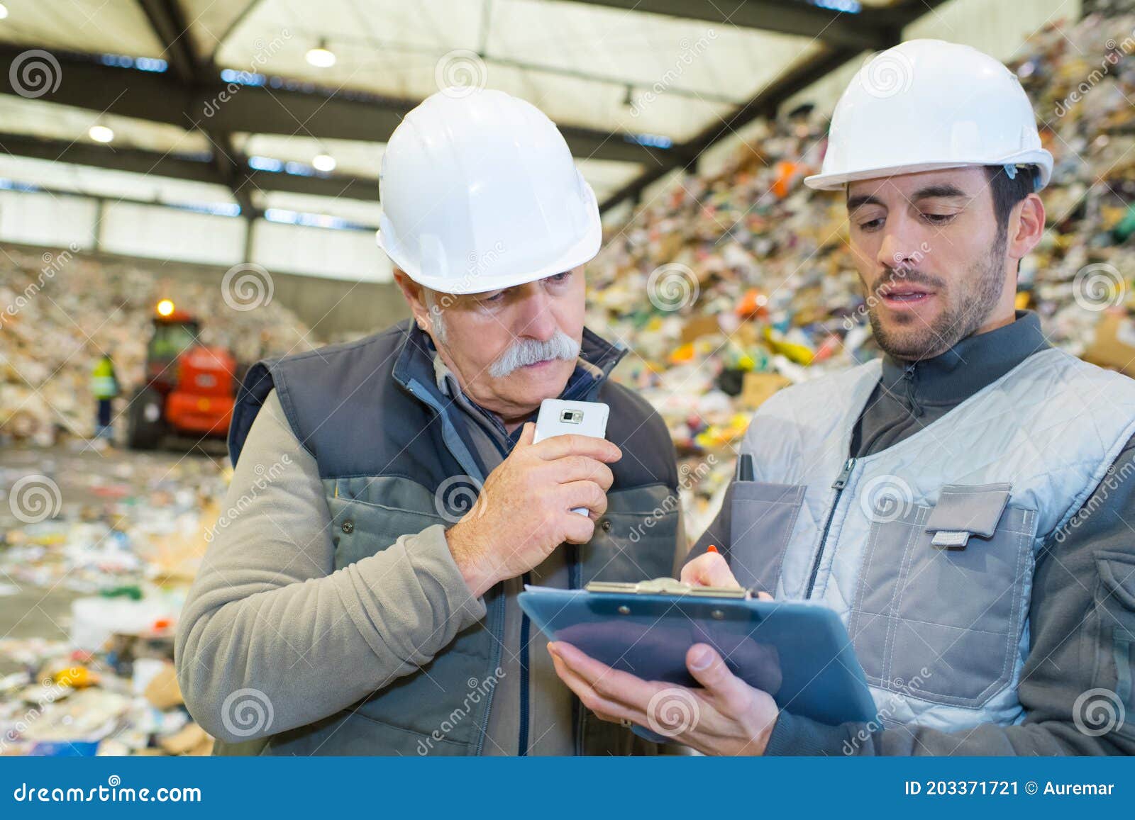 Two Caucasian Workers Communicating in Recycling Center Stock Image ...