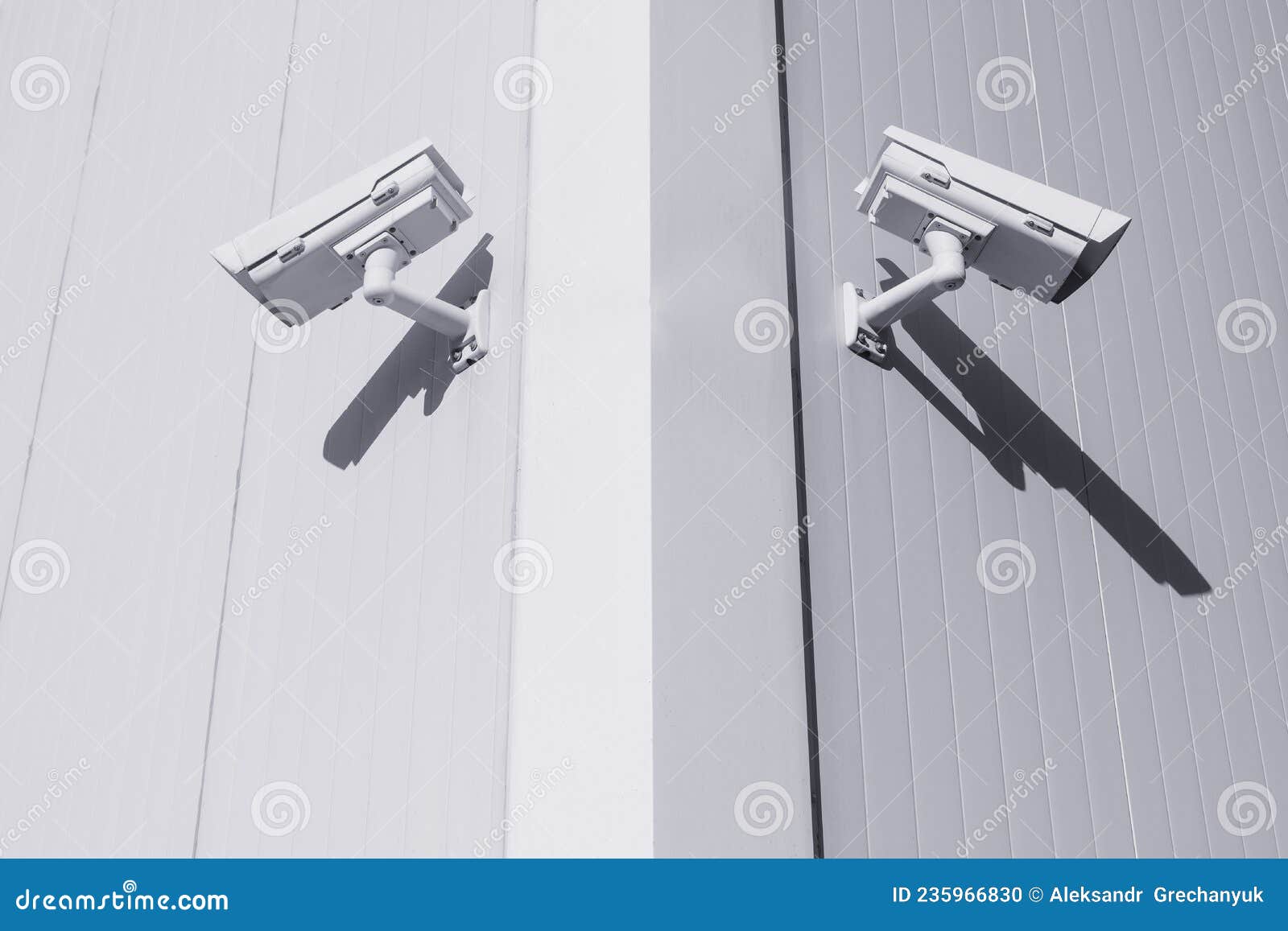 Two CCTV Cameras in Different Directions at the Corner of the Building ...