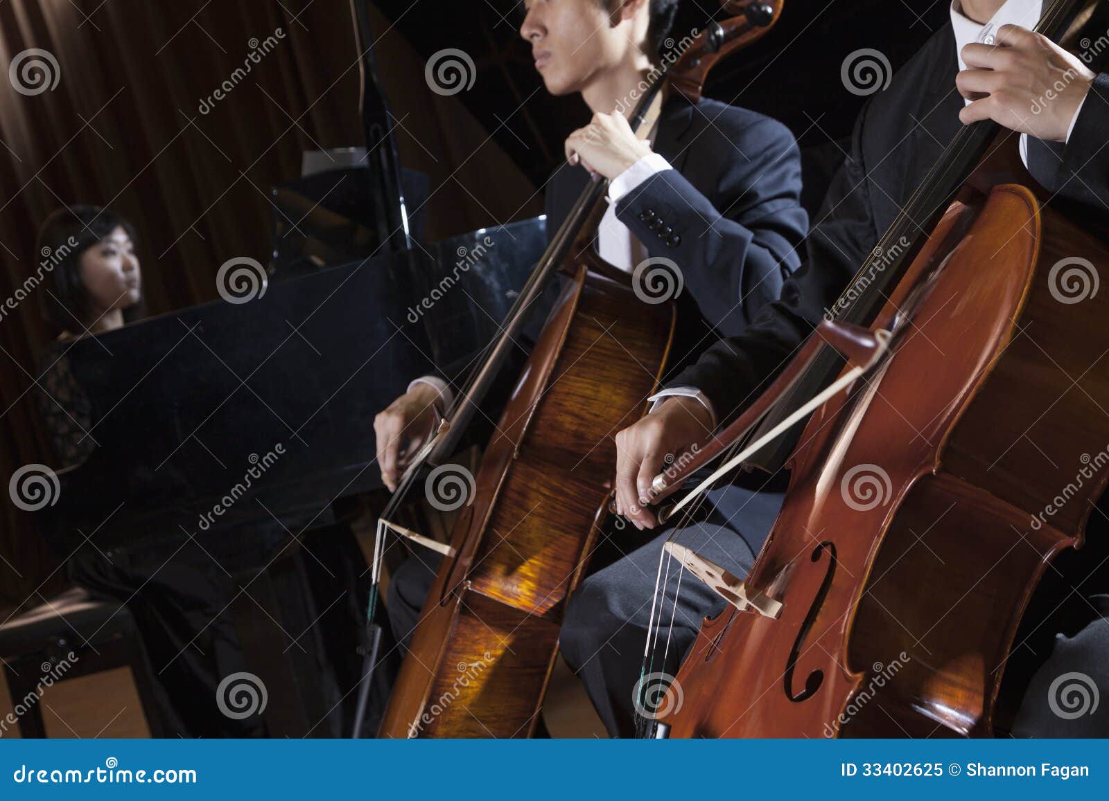 Two Cellists Playing the Cello during a Performance Stock Image - Image ...