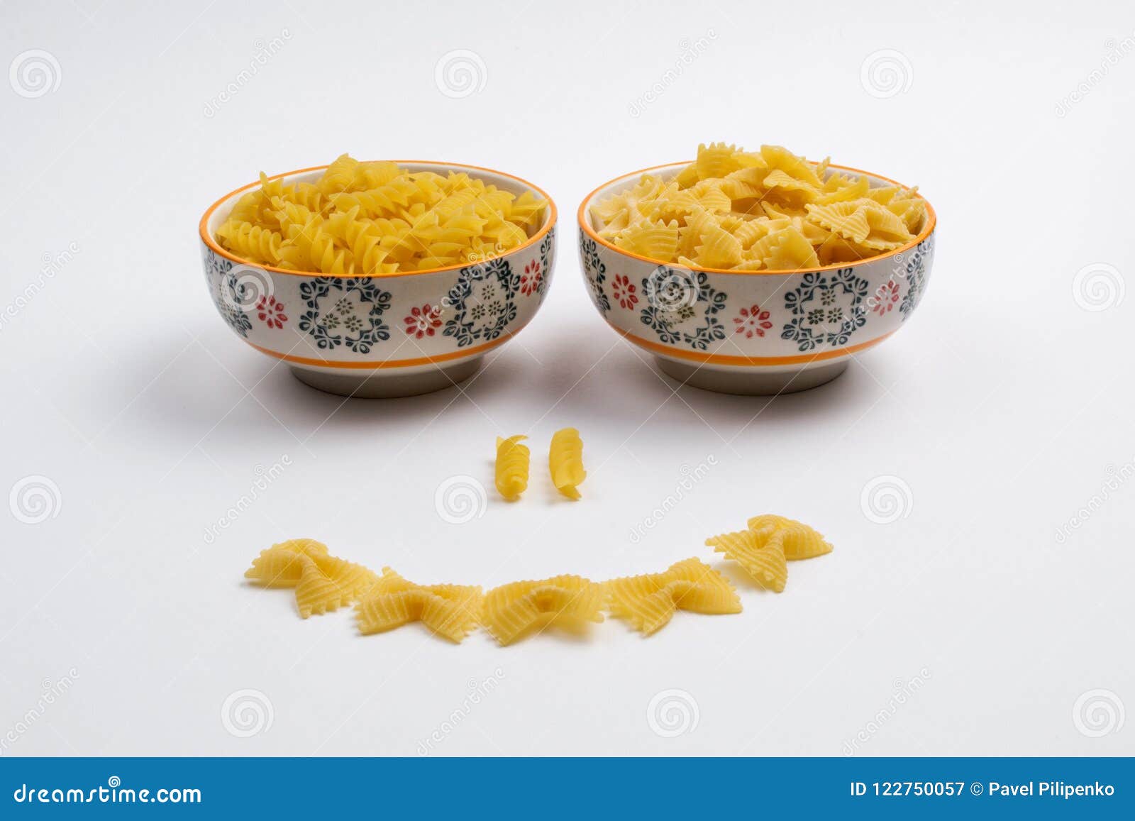 Two Ceramic Bowls Full of Pasta Make Up a Smiling Face Stock Image ...