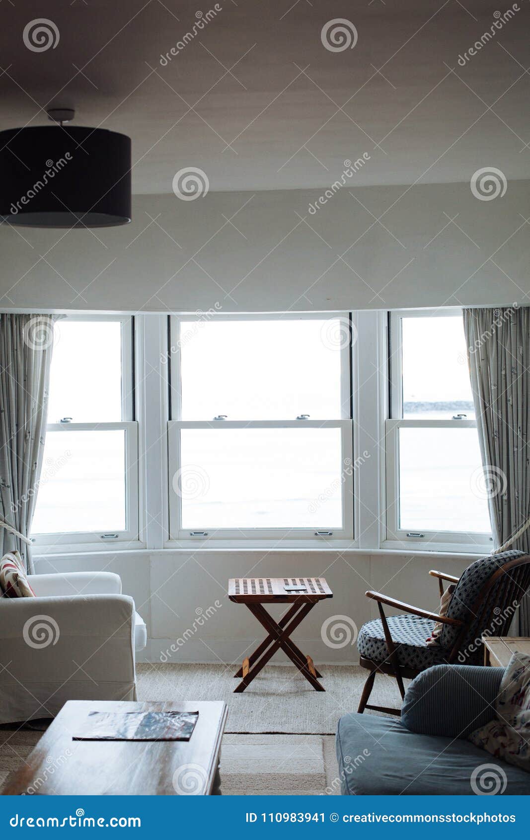 Two Chairs Facing Towards White Casement Window Picture. Image: 110983941