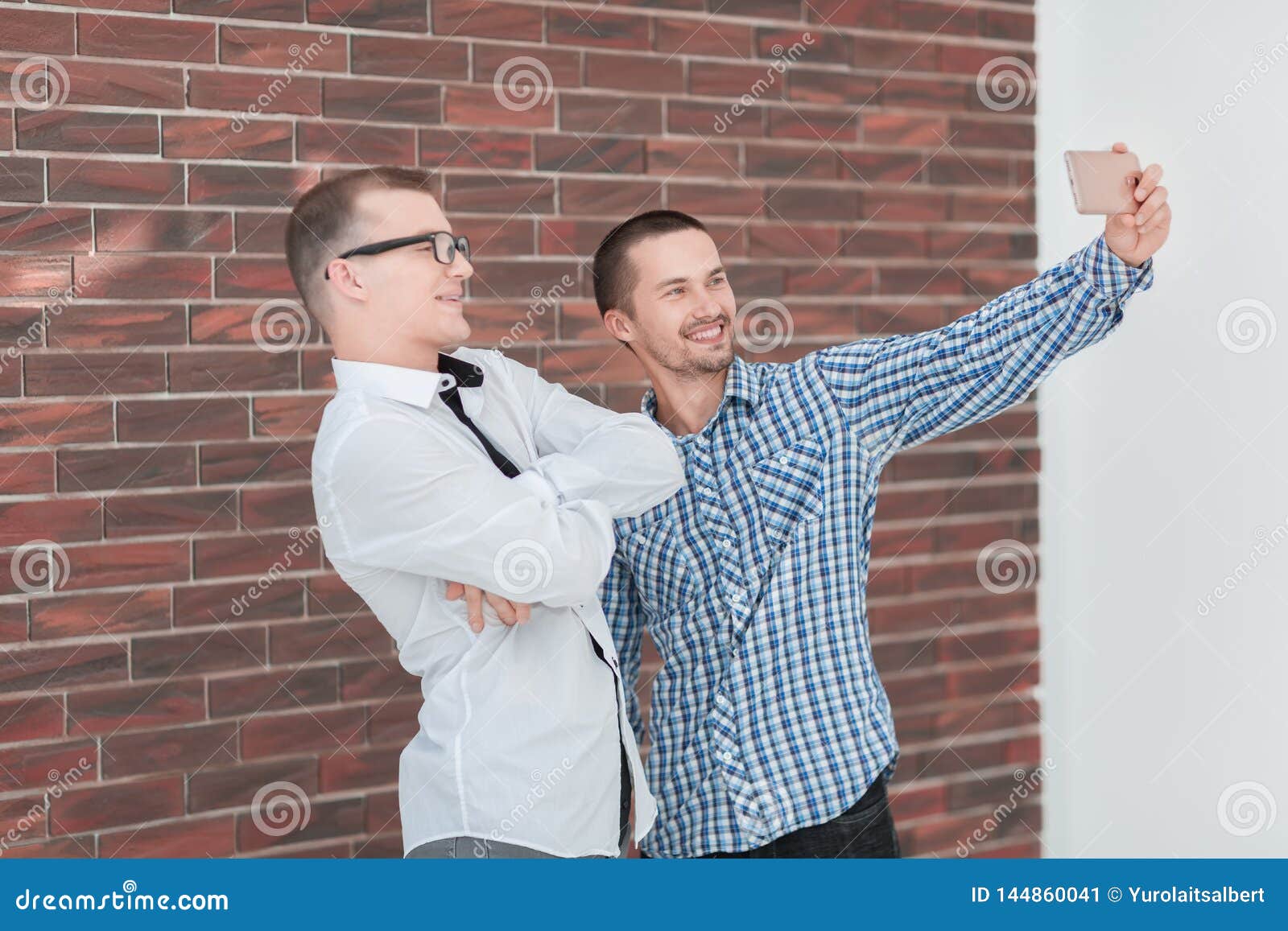 Two Cheerful Co-workers Taking Selfies Standing in the Office Stock ...