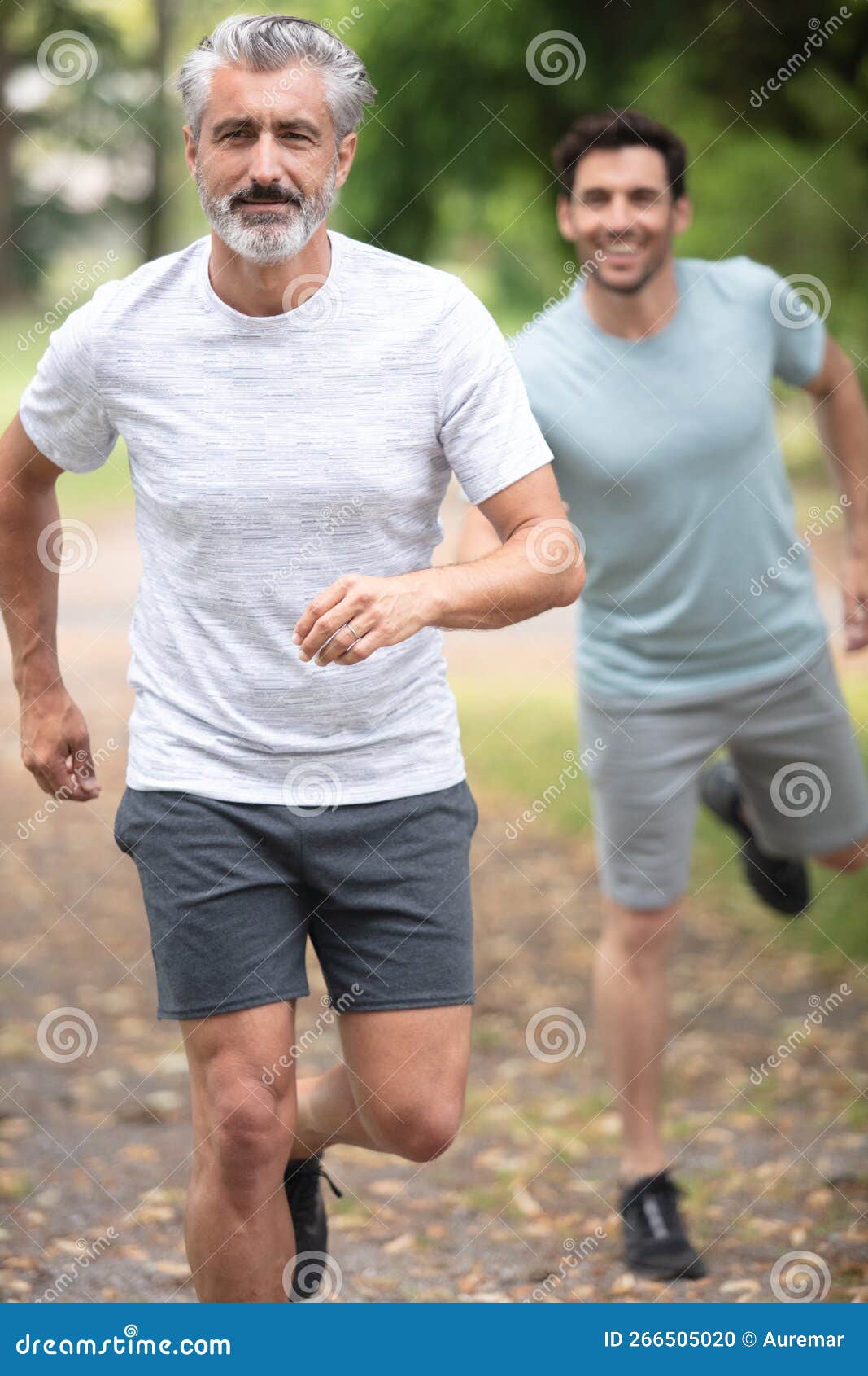 Two Cheerful Men Jogging in Park Stock Photo - Image of exercising ...