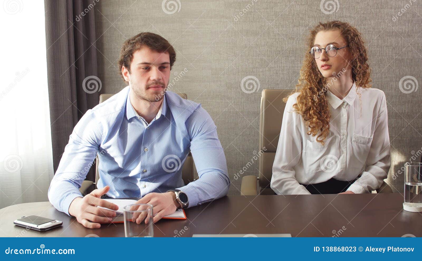 Two Cheerful Office Workers Sitting at Conference Table Stock Video ...