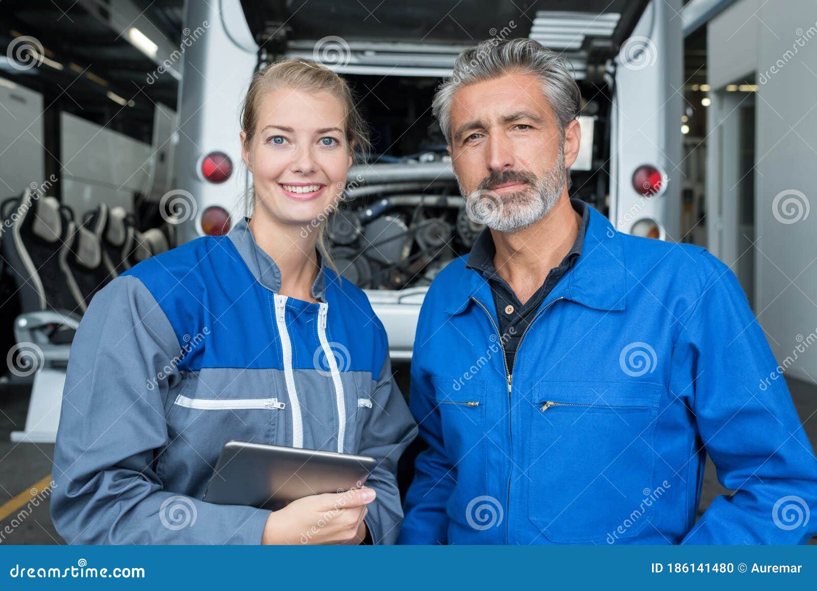 Two Cheerful Smiling Mechanics Looking at Camera Stock Photo - Image of ...