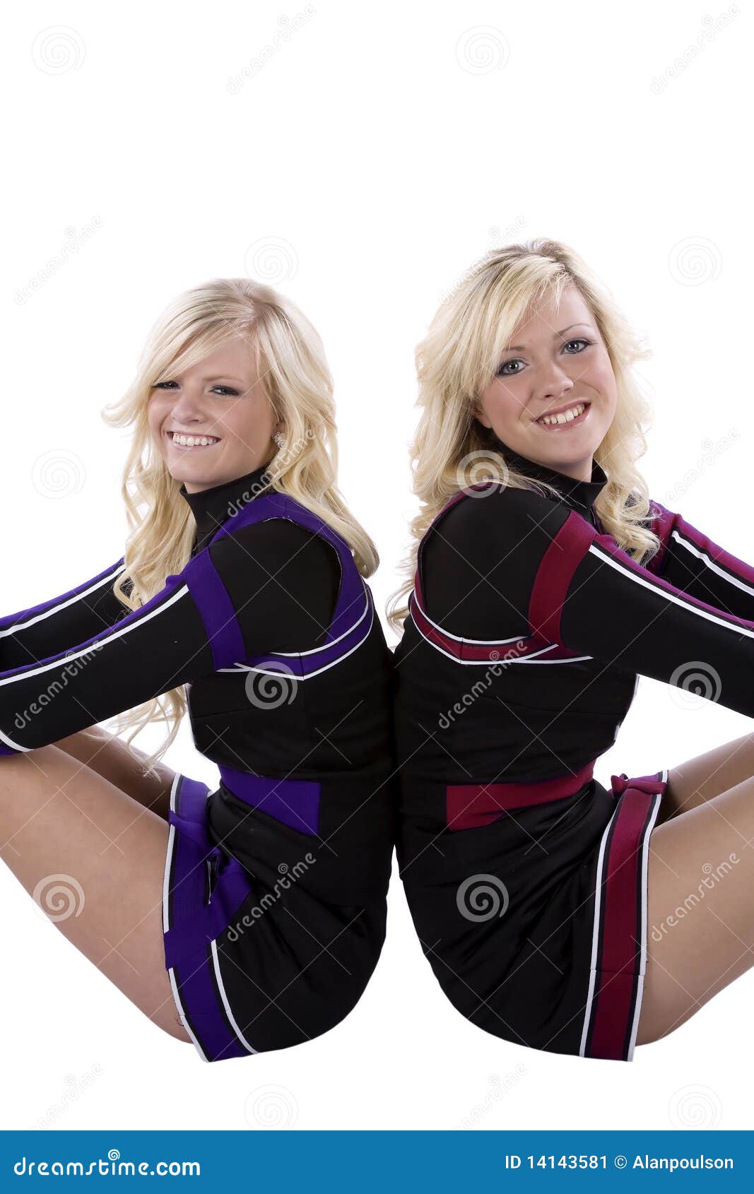 Cheerleaders Sitting With Legs Crossed At Knee On Field Stock Image ...