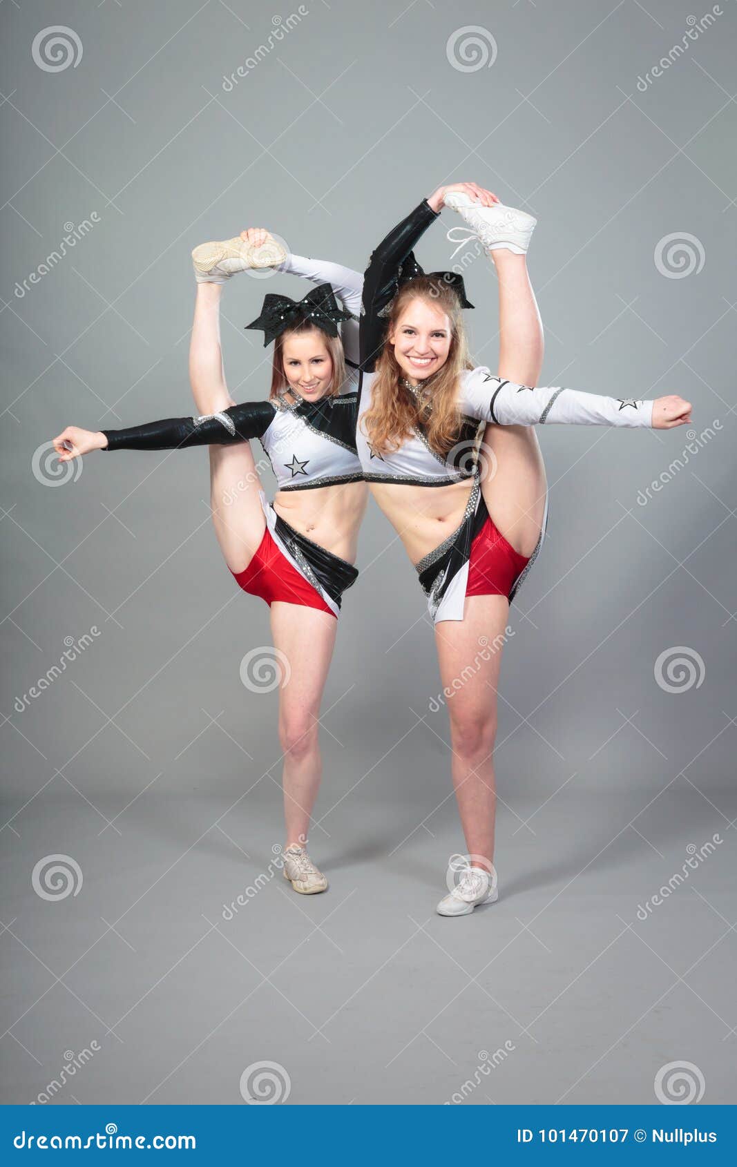Two Cheerleaders Performing a Bow and Arrow Stock Image - Image of people, team: 101470107