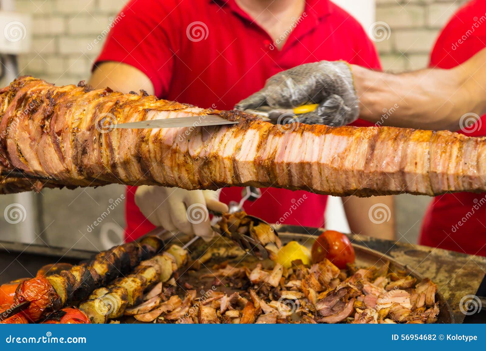 Two Chefs Carving a Spit Roast Stock Photo - Image of appetizing ...
