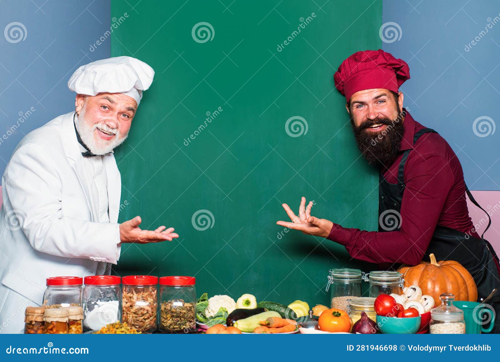 Two Chefs in Cook Hat Pointing Spoon on Blank Board Menu. Happy Chef ...