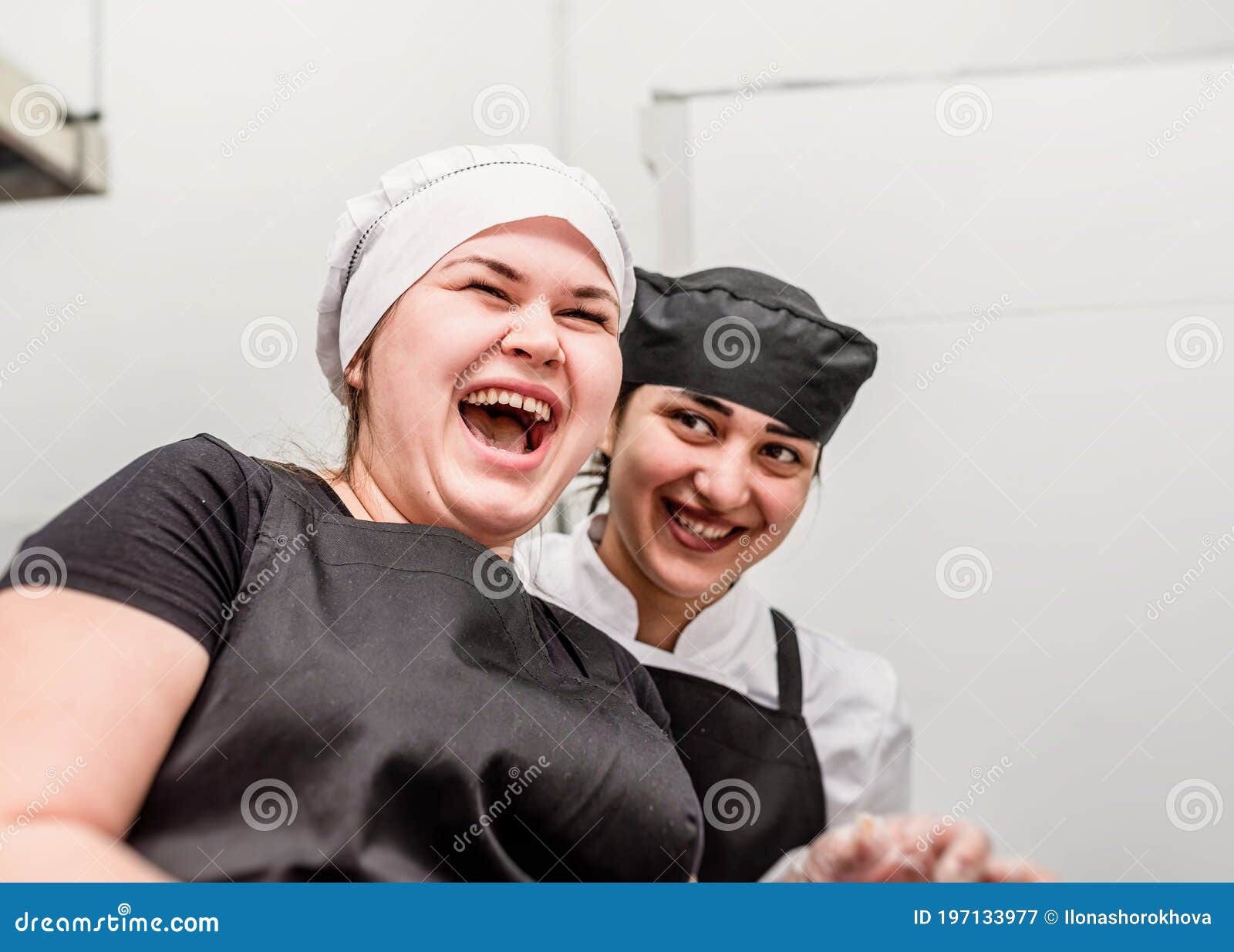 Two Chefs Laughing at the Kitchen Stock Image - Image of beautiful ...