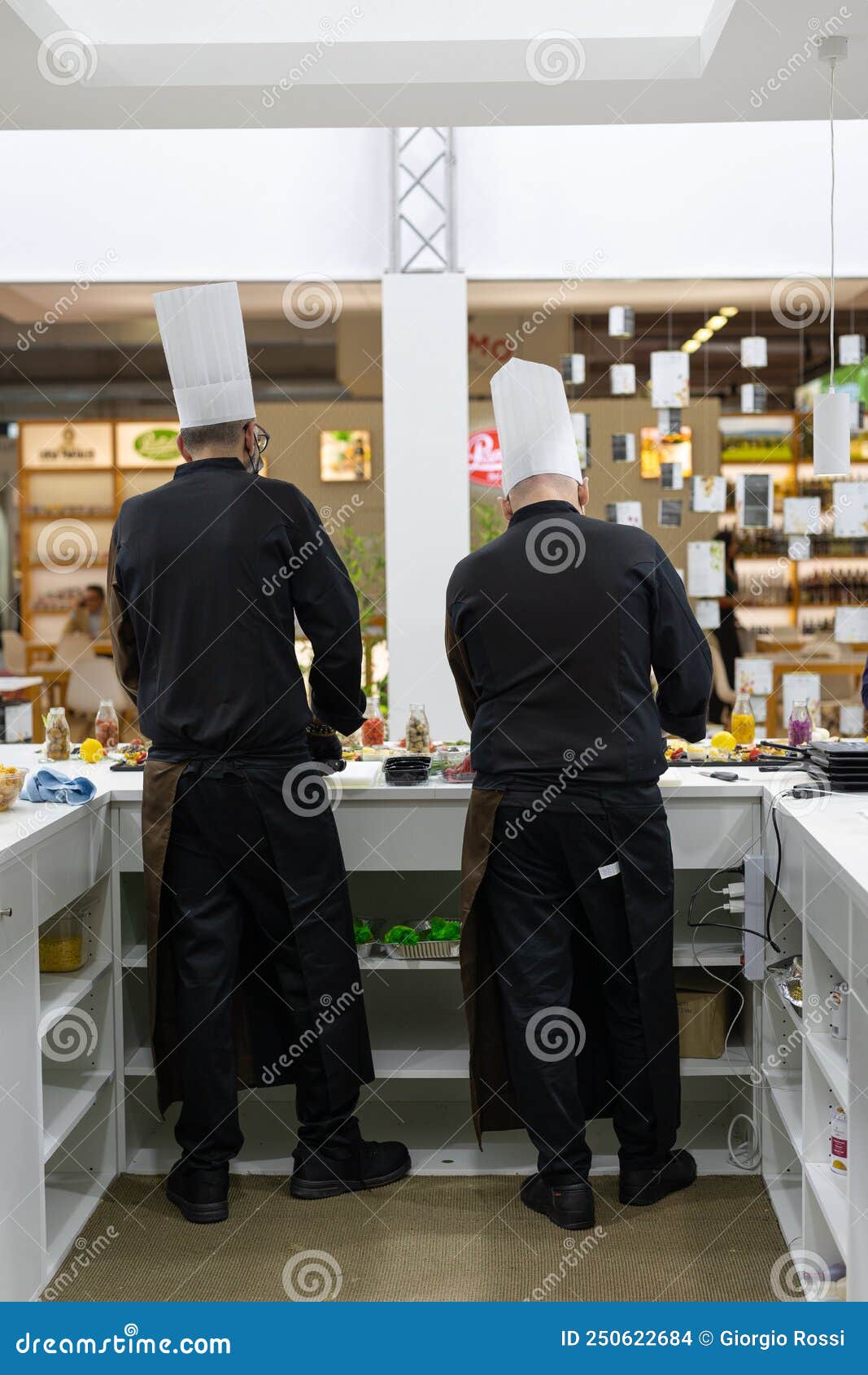 Two Chefs Seen from Behind: Serving Diners Behind Their Table Editorial ...