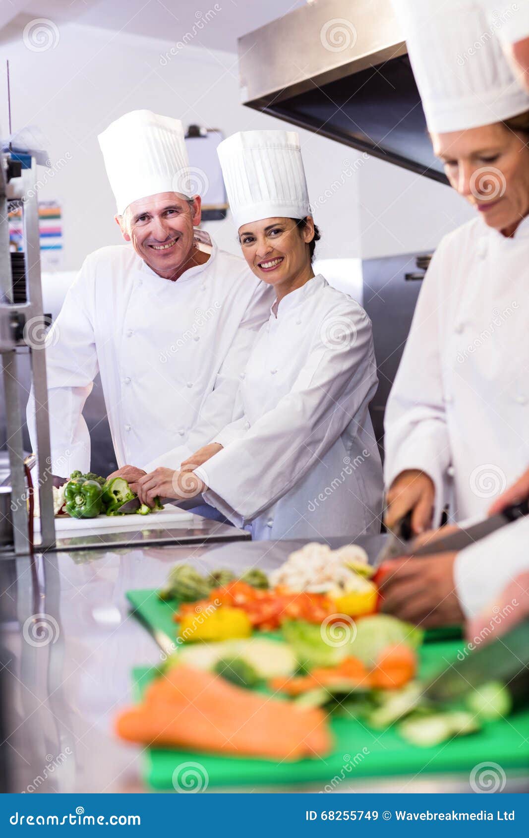 Two Chefs Smiling at Camera while Chopping Vegetables Stock Image ...