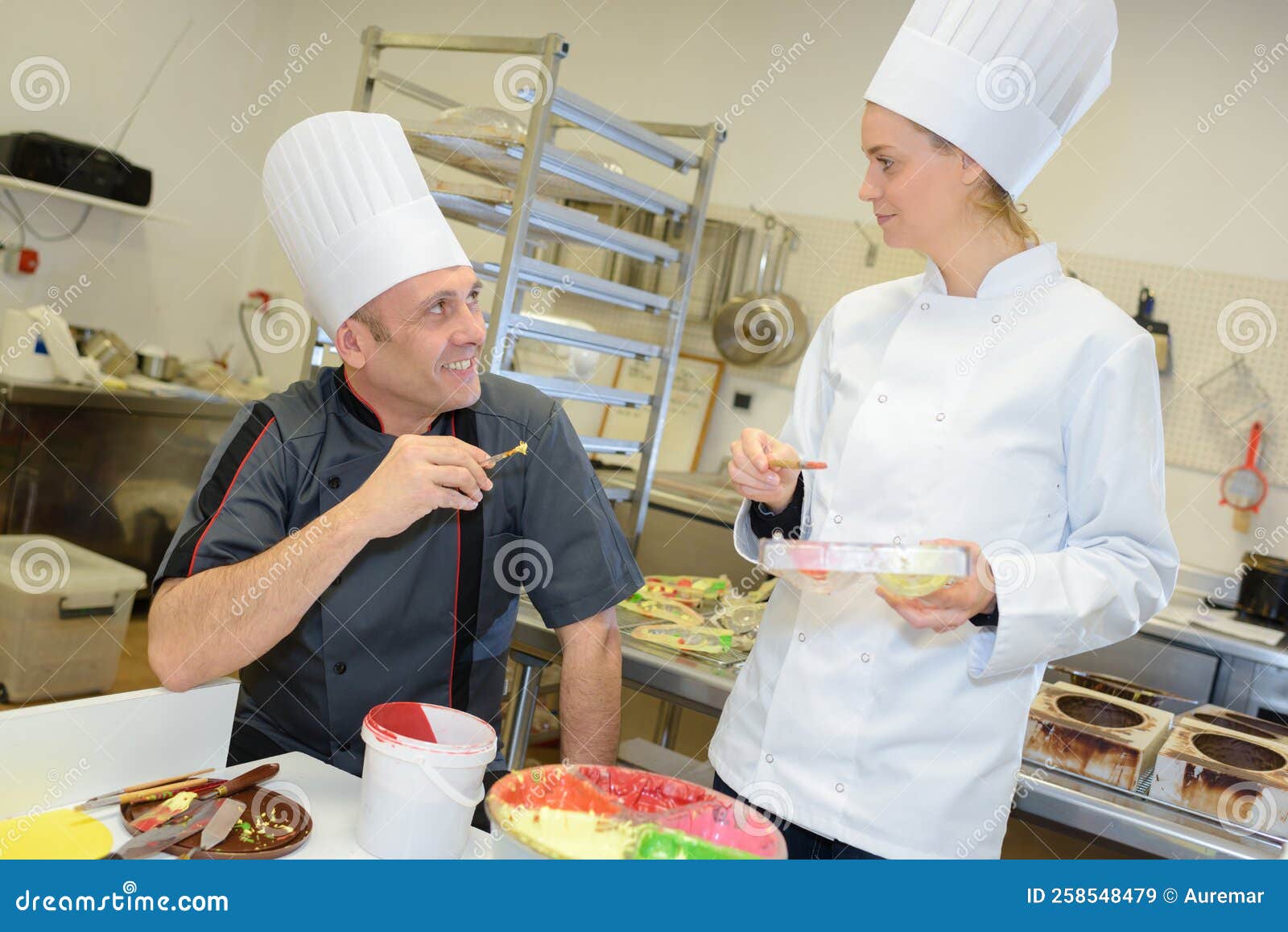 Two Chefs Talking about Cake Stock Image - Image of pretty, woman ...