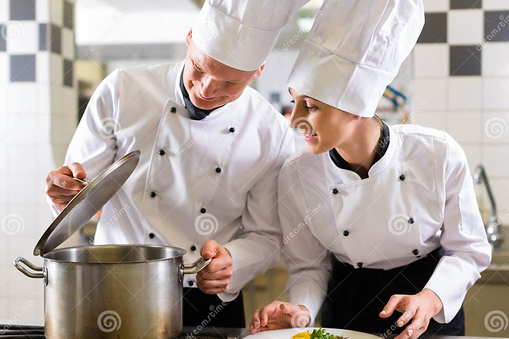 Two Chefs in Team in Hotel or Restaurant Kitchen Stock Image - Image of ...