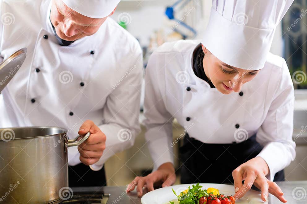 Two Chefs in Team in Hotel or Restaurant Kitchen Stock Image - Image of ...