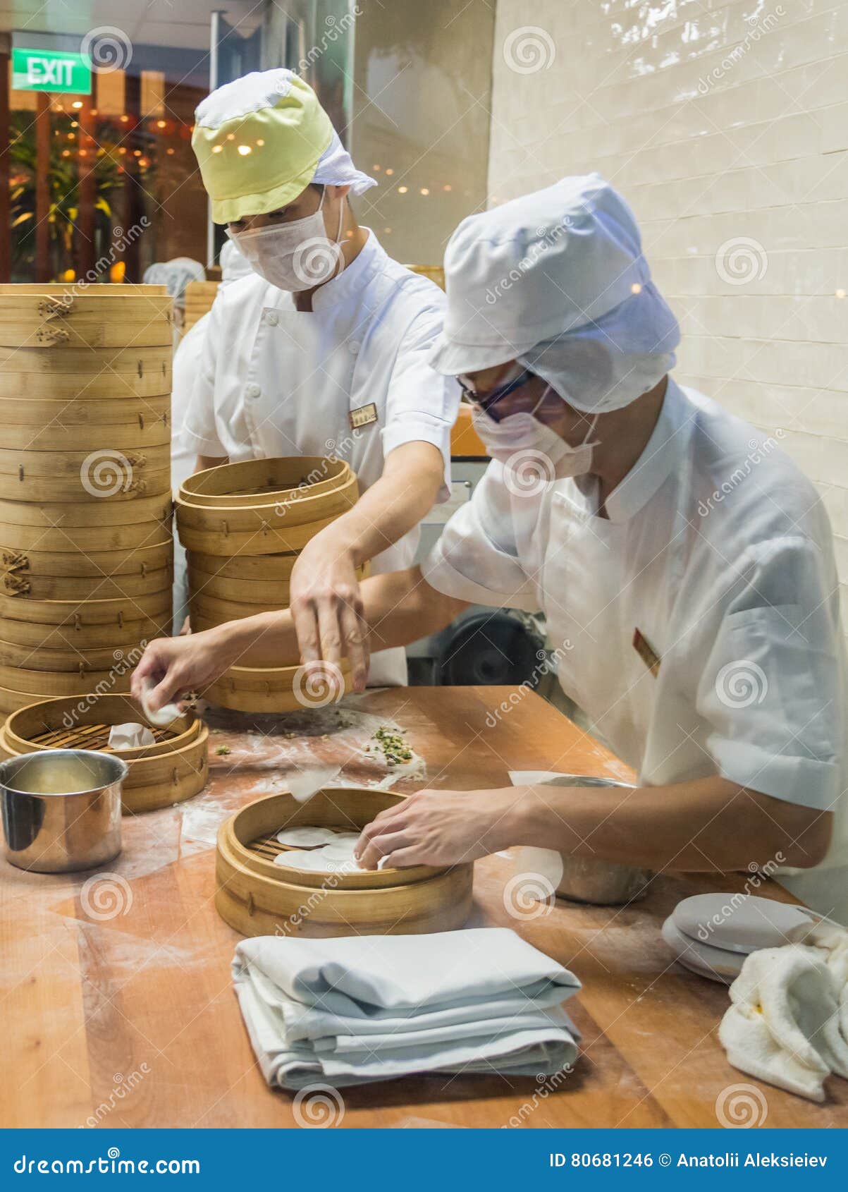 Chefs In White Uniforms Cooked Dish Of Dough In A Clean Kitchen ...