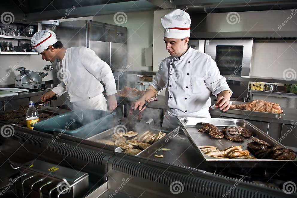 Two chefs at work stock photo. Image of gourmet, chef - 6401604