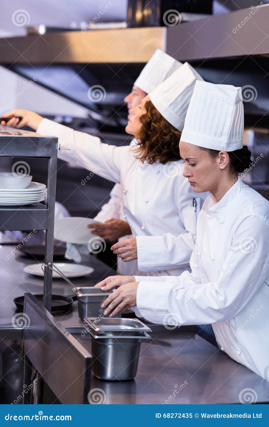 Two Chefs Working at Order Station in a Kitchen Stock Image - Image of ...